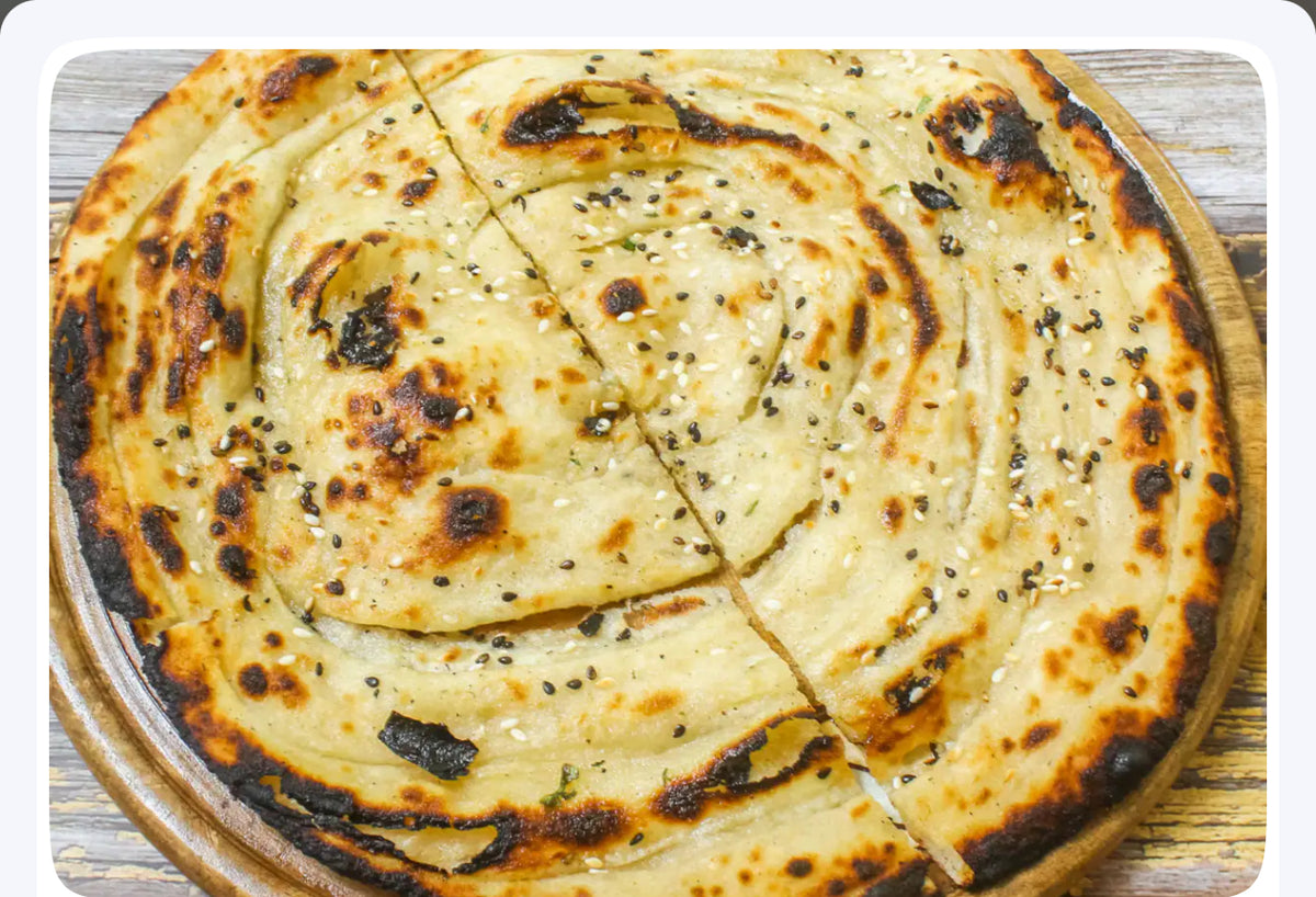 Butter Naan – Dal Samarkand. A unit of Ujval Ahuja